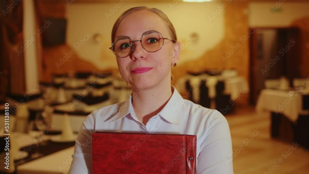 Woman business owner. Portrait of a female waitress in a white shirt ...