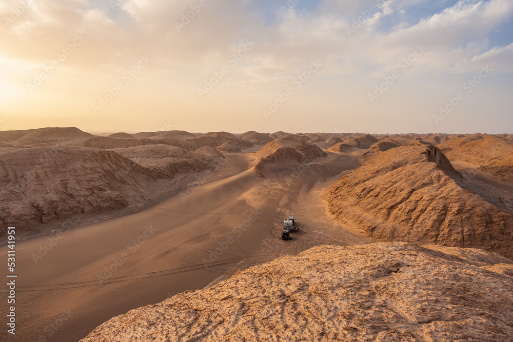 Three campers in the middle of the desert at sunset. The Kalut desert ...
