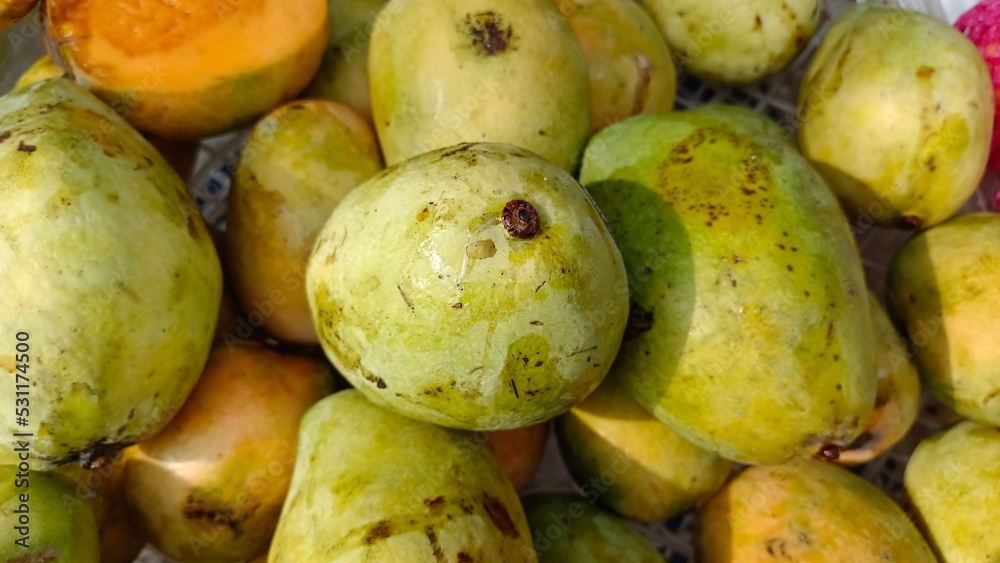 Gedong mango is green, bright orange and the texture of the flesh is ...