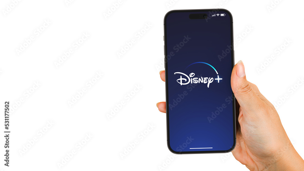 Foto de Female hand holding a smartphone iPhone 14 Pro with Disney Plus ...