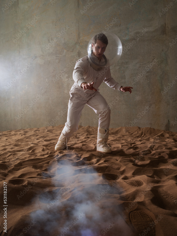 Fear of the unknown on alien planets. An astronaut in a white spacesuit ...