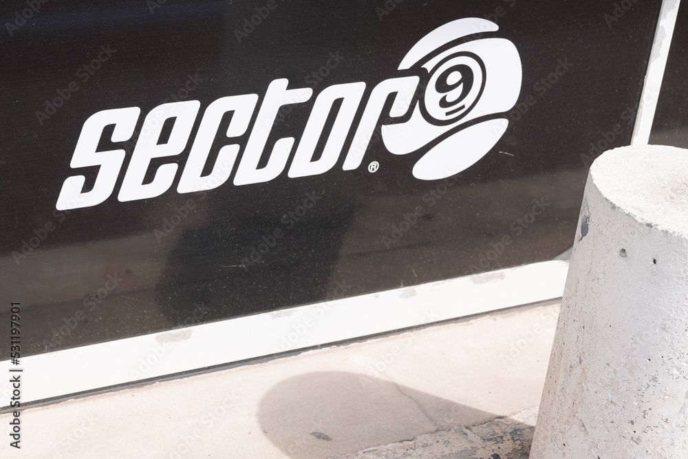 Sector Nine logo sign and brand text on store facade clothing shop ...