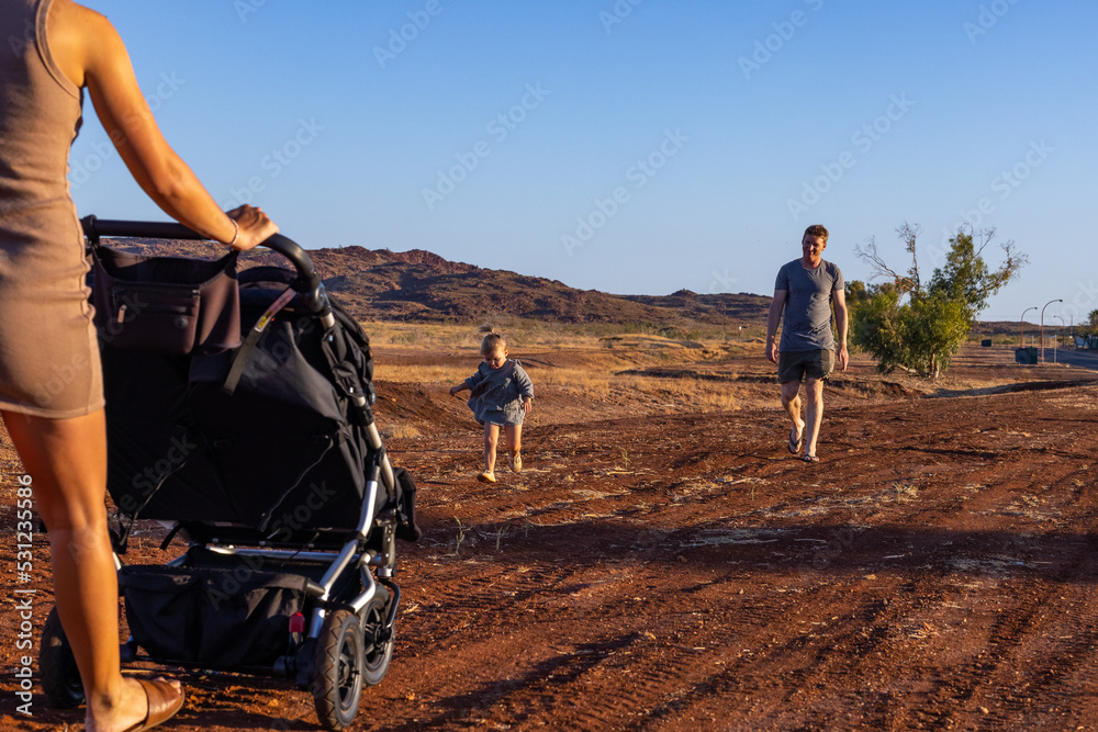 family out walking with pram in the Pilbara Stock Photo | Adobe Stock