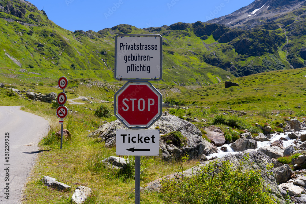 Stop sign and sign with text ticket at Swiss mountain pass Sustenpass ...