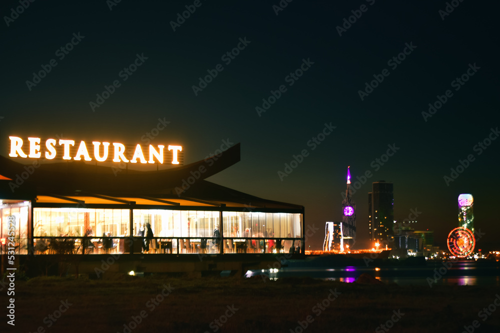 Fotografia do Stock: Restaurant building at night with batumi ...