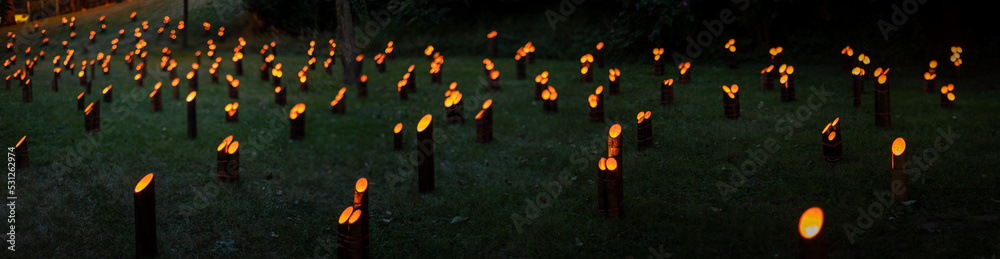 Hundreds of Japanese bamboo lanterns - candles in bamboo stands ...