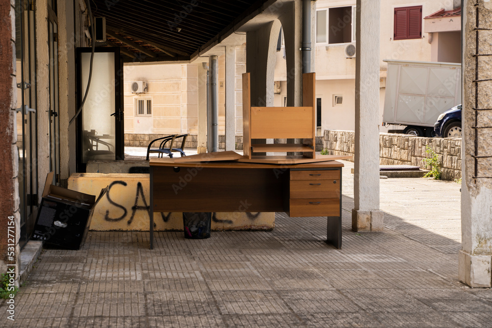thrown out on the street home wooden furniture. A chipboard table ...