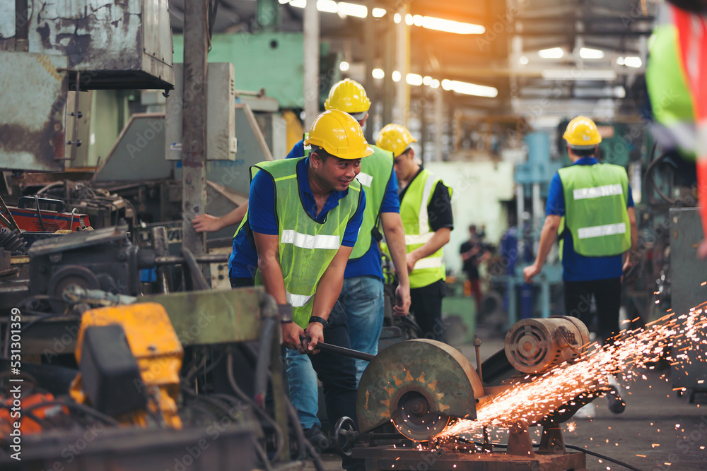 Group of Asian male worker working with metal cutting saws. Team of ...