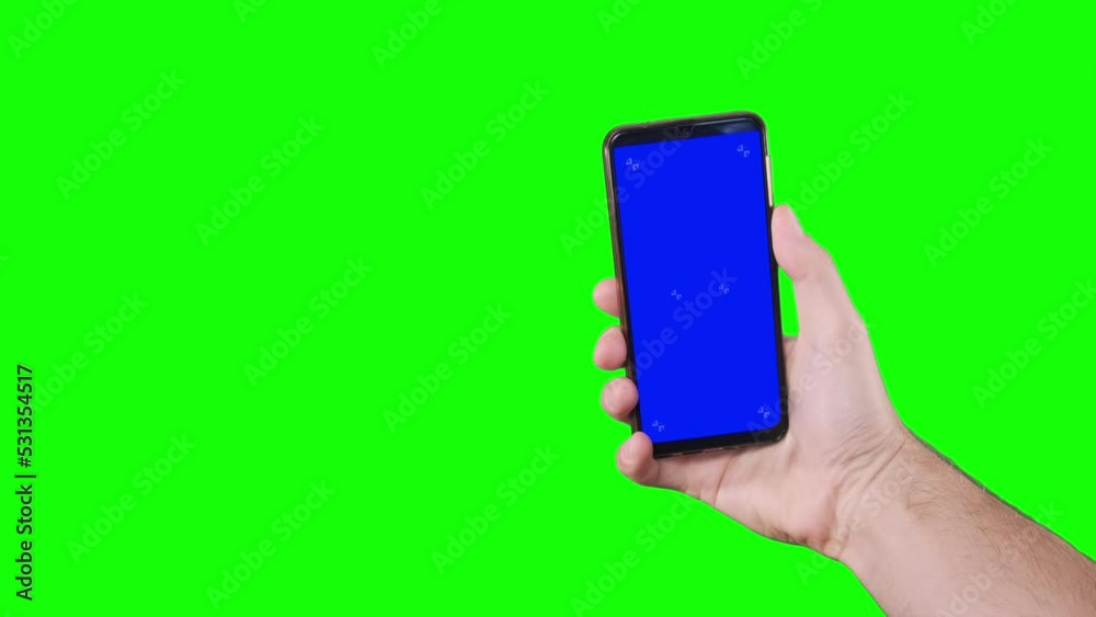 Male hand holding a smartphone with a blue screen and trackers on a ...