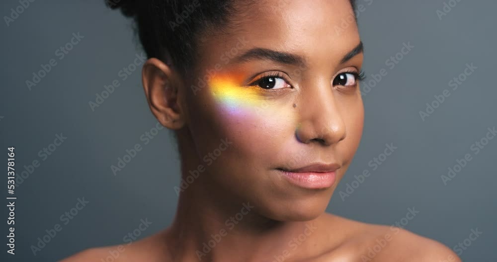 Rainbow, prism and light on face of black woman for glow, beauty or ...
