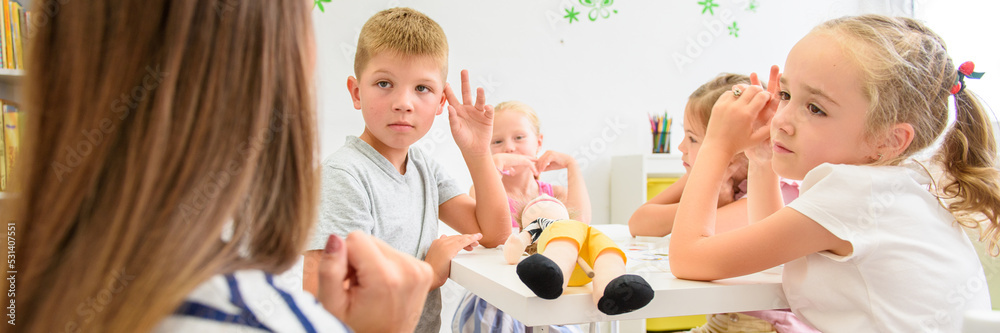 Child occupational therapy session. Group of children doing playful ...