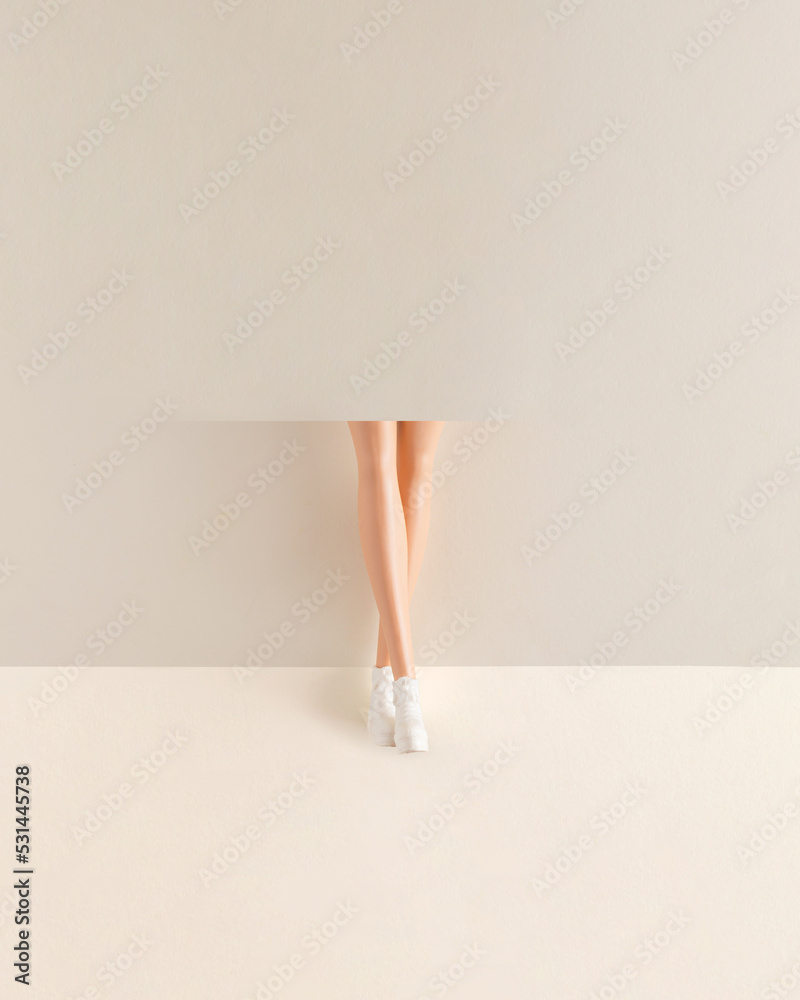 Beautiful thin long female legs peeking out behind a paravane. Pastel ...