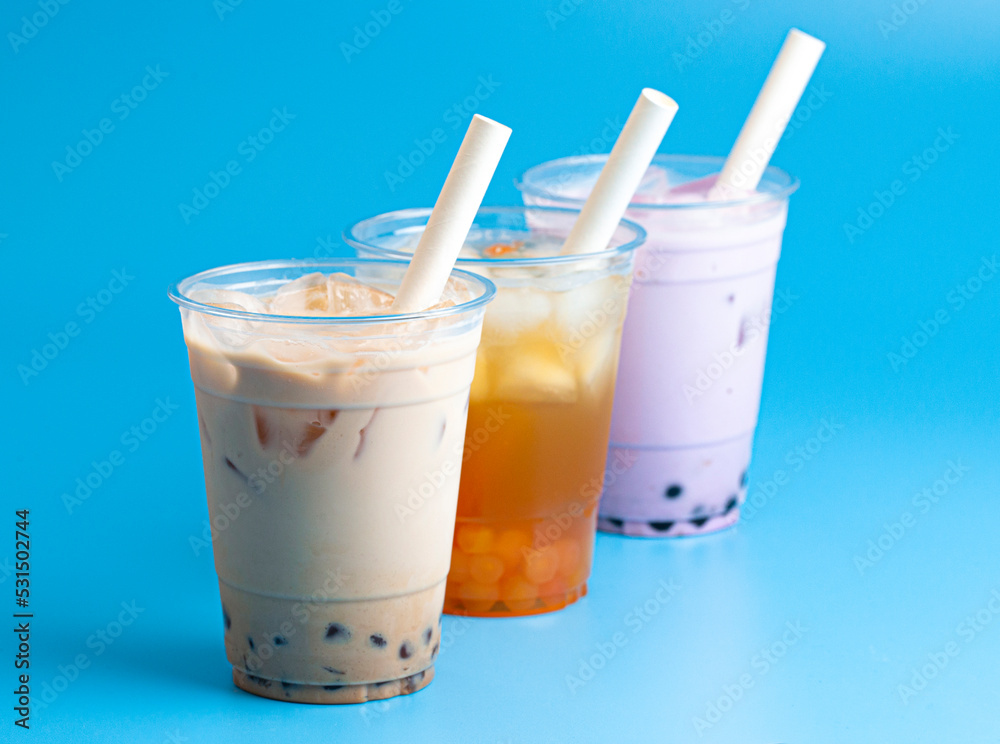 Three Different Types of Boba Tea on a Bright Blue Background Stock ...