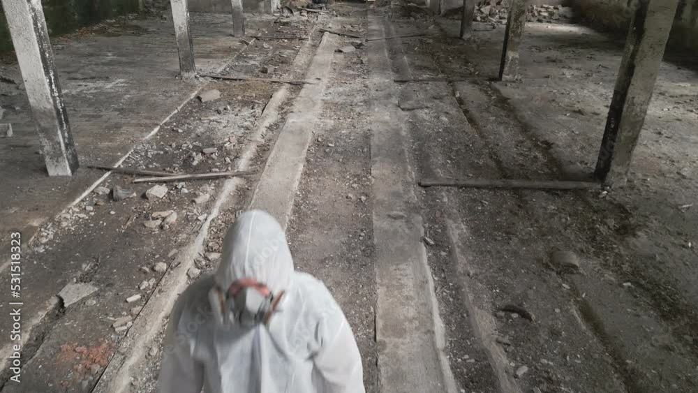 A forensic scientist with a briefcase walks down an empty hall to the ...