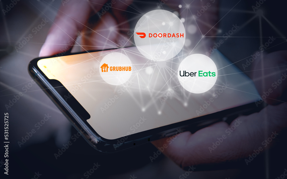 Logos of food delivery services Doordash, GRUBHUB and UberEats hover ...