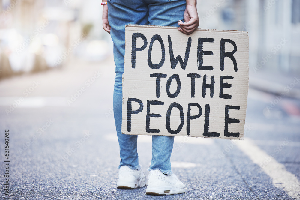 Power to the people cardboard protest poster in a city street for ...