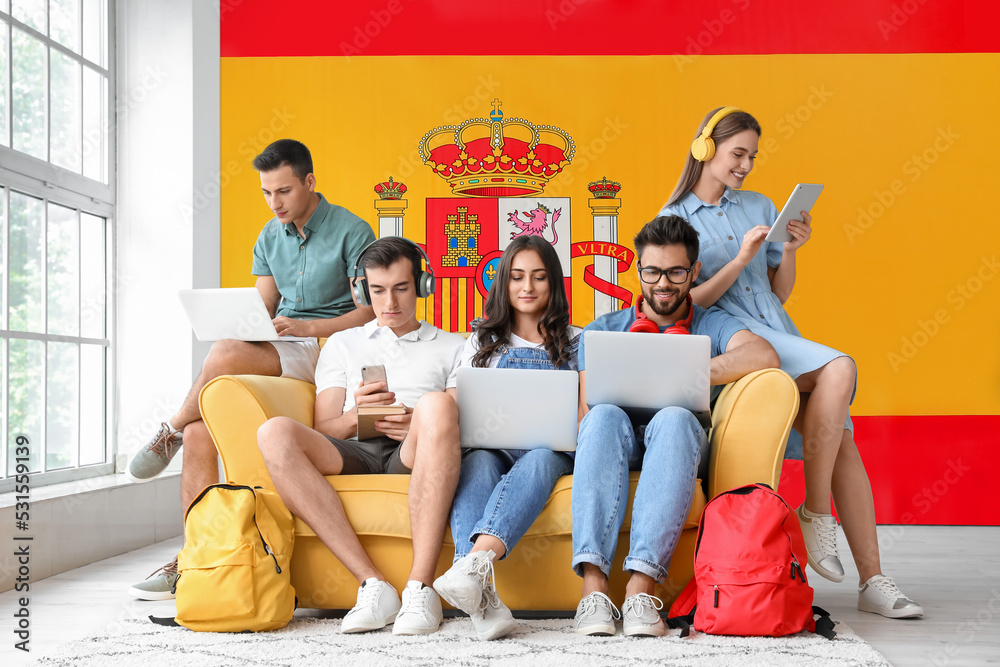 Students with modern devices indoors. Concept of studying Spanish Stock ...