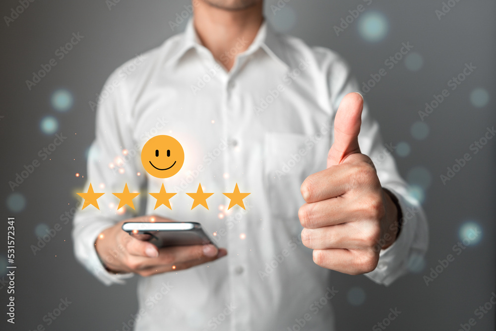 Customer satisfaction concept. The businessman's holding smartphone ...