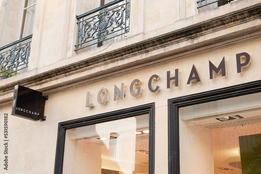 longchamp logo and sign text front of facade entrance store fashion ...