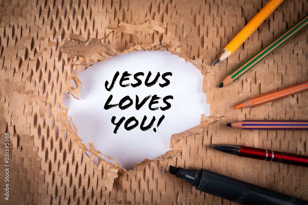 Jesus Loves You. Text and stationery on cardboard background Stock ...