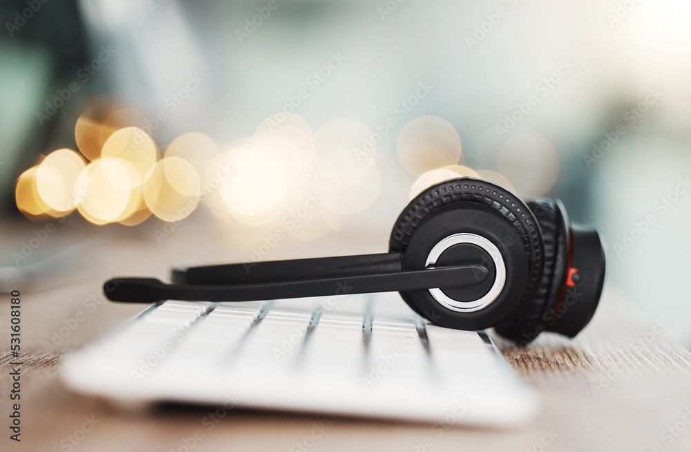Call center headphones, computer keyboard and telemarketing background ...