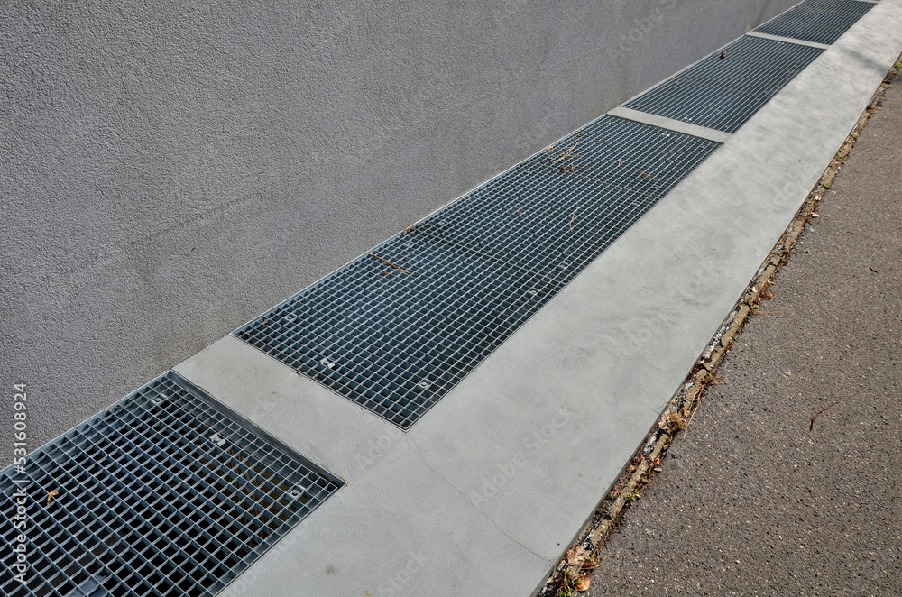 Ventilation grille along the house. basement windows are below ground ...
