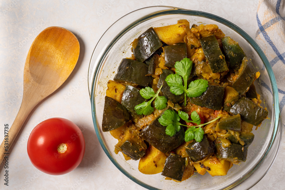 Spicy purple eggplant or aubergine vegetable cooked with onions ...