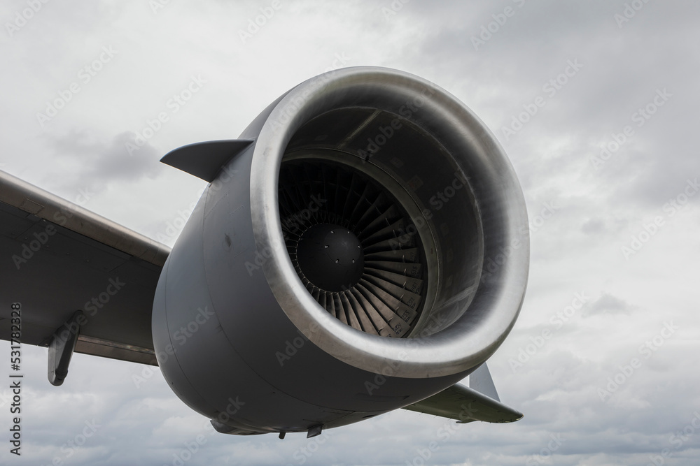 Detail of aircraft engine. Jet turbine on the aeroplane and plane wing ...