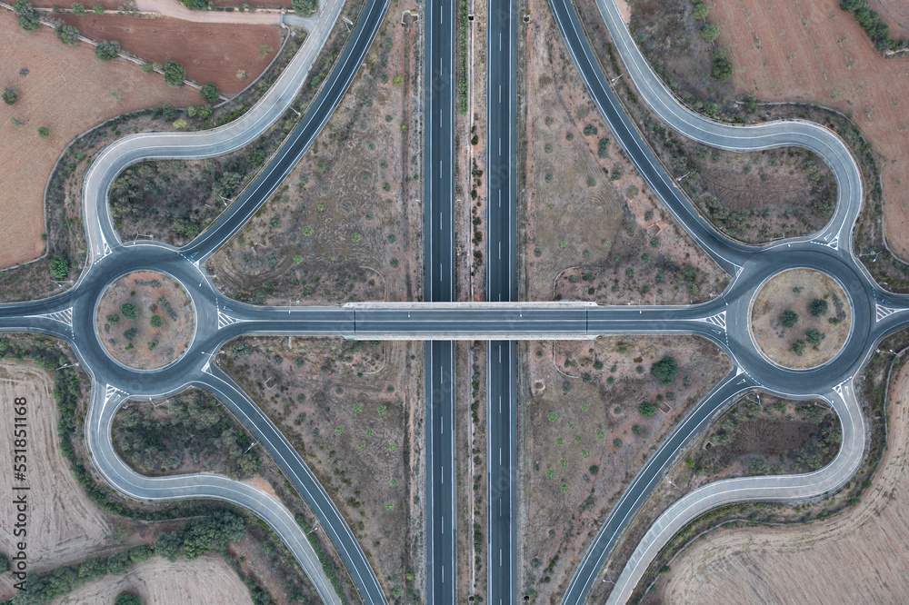 Aerial view of a bridge and highway lanes, roundabouts and conjunctions ...