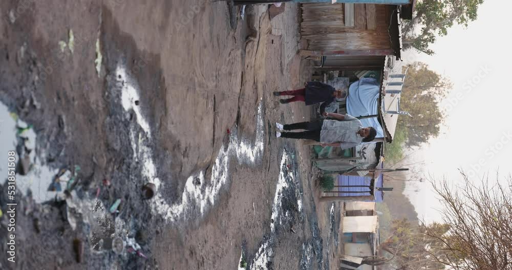 Stockvideo Vertical video.Poverty. Inequality.Black African mother and ...