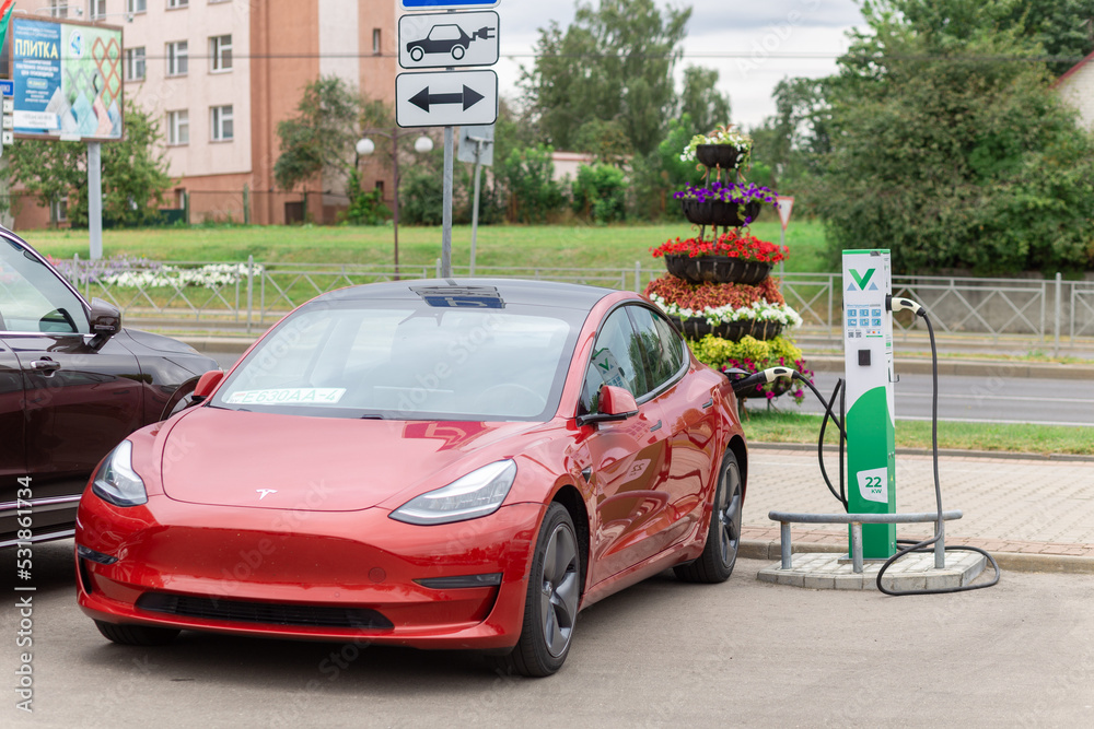 Tesla Model Y on 22W charging spot Stock Photo | Adobe Stock