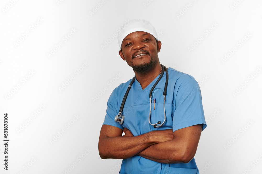 Smiling black surgeon doctor bearded man in blue coat and medical cap ...