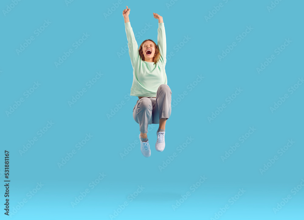 Joyful excited woman clenching her fists rejoicing in her victory or ...
