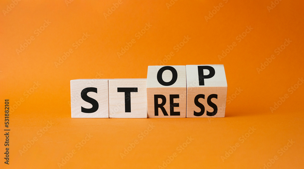 Stop and Stress symbol. Turned wooden cubes with words Stress and Stop ...
