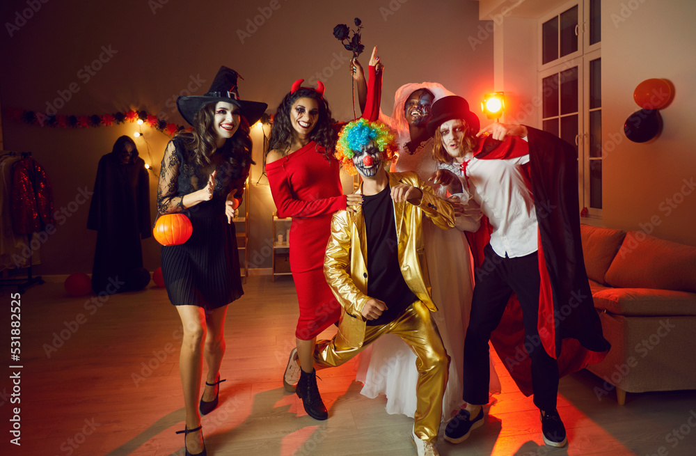 Halloween theme. Portrait of multiracial adult friends in spooky ...