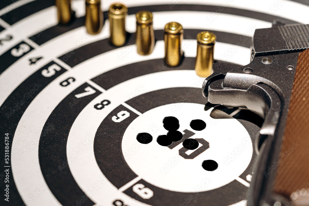 Gun and many bullets shooting targets. Training for aiming and shooting ...