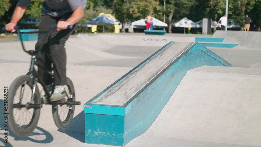 A professional cyclist rides and performs tricks on bmx. Beautiful ...