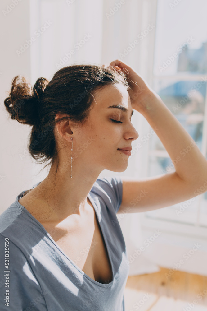 Vertical side view of charming beautiful relaxed brunette woman ...