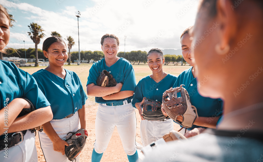 Team of women baseball players, given strategy and motivation by coach ...