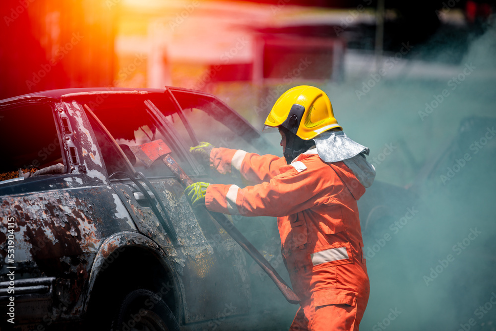 Firefighter man wearing protective fire suite and helmet with equipment ...