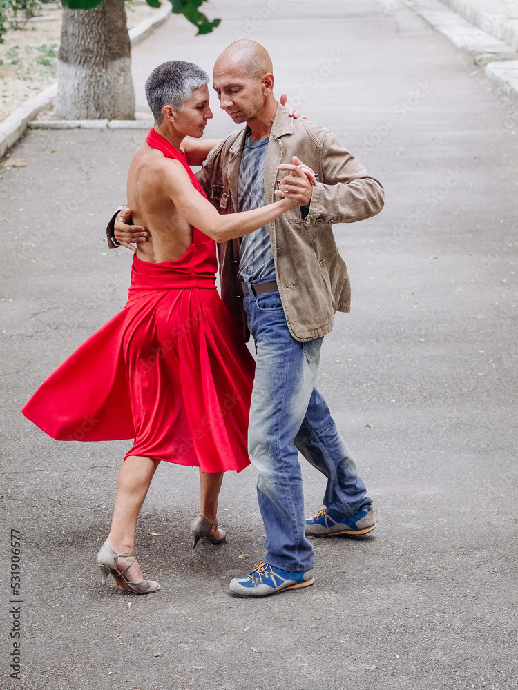 Tango nuevo dance - the famous partner dance with a woman in a red ...