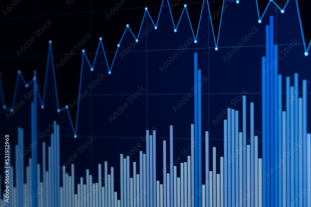 Line chart and bar chart. Close-up of a blue chart on a dark background ...