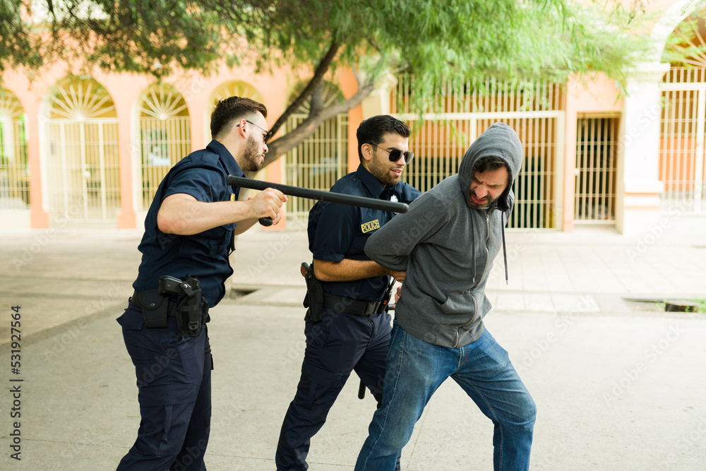 Angry cops agents making an arrest Stock Photo | Adobe Stock