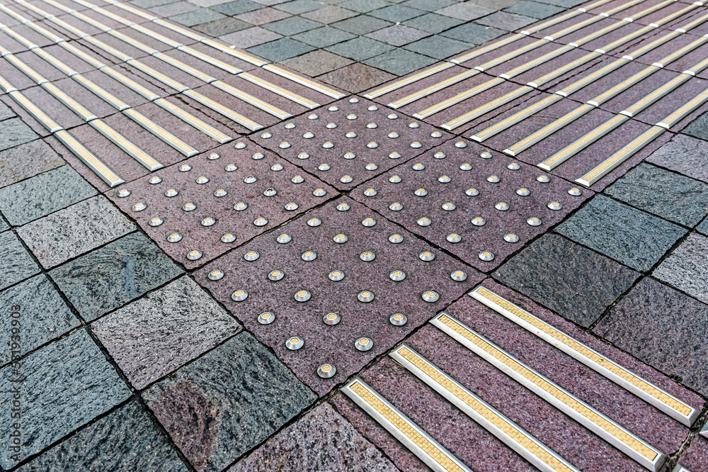 Tactile tiles at the crossing of the road in Tokyo city in Japan Stock ...