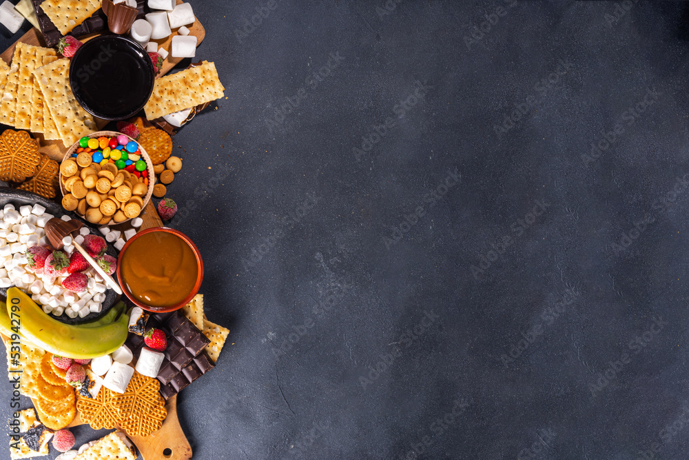 S'mores home party food and ingredients. Smores buffet background with ...
