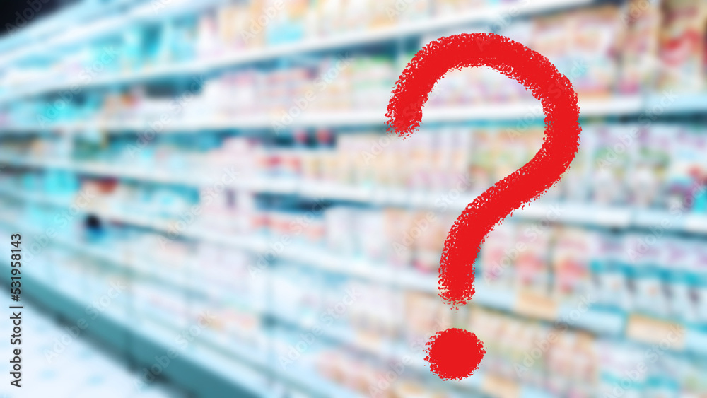 Large red question mark on blur supermarket background. Defocused ...