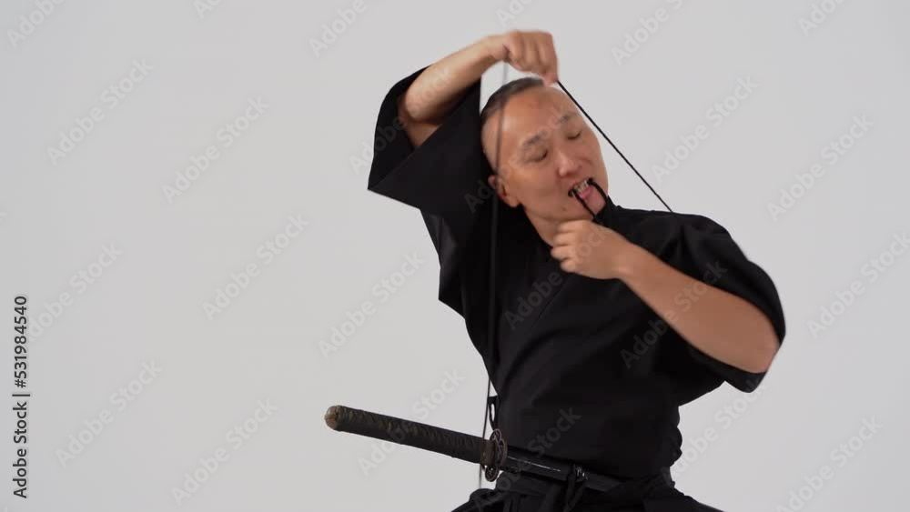 Japanese man traditional dress, black kimano katana samurai sword ...