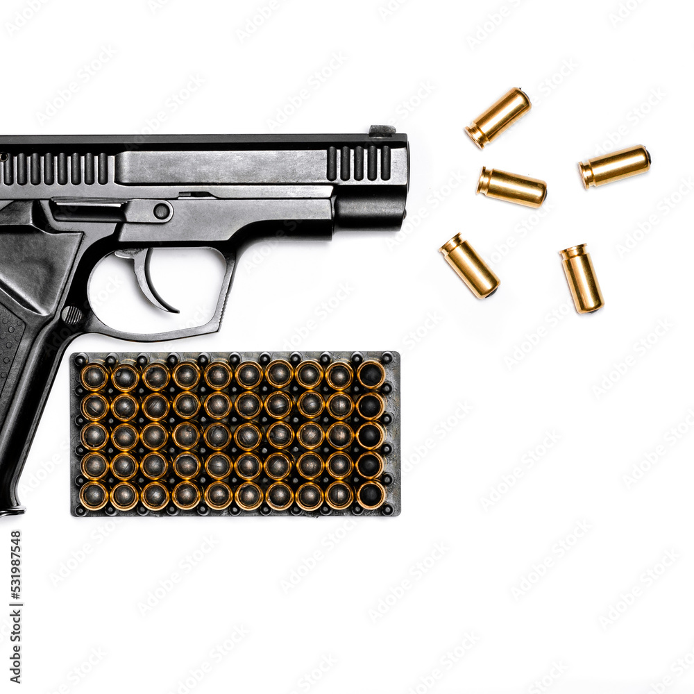Traumatic pistol with cartridges lies on a white background Stock Photo ...