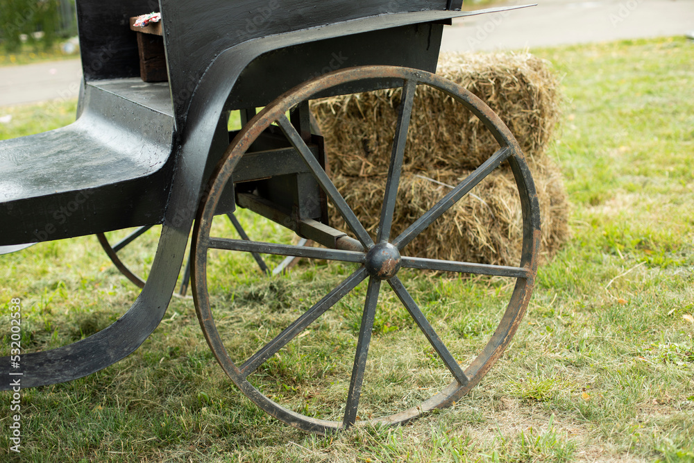 Vintage wheel. Large carriage wheel. Black carriage of bygone era ...