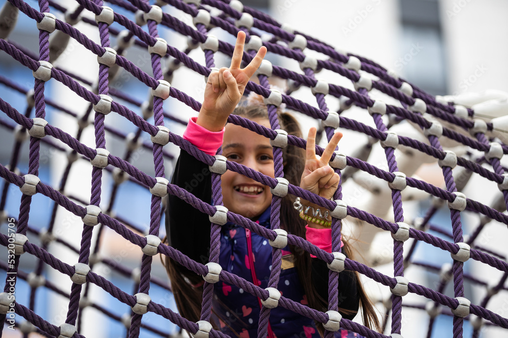 Cute teenage girl in the rope labyrinth kid park attraction Stock Photo ...